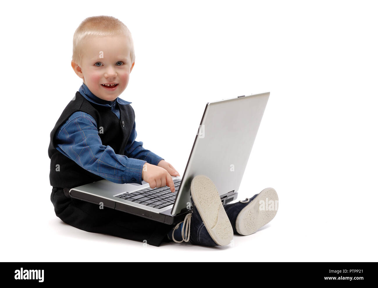 Little boy with a laptop on white background, isolated Stock Photo - Alamy