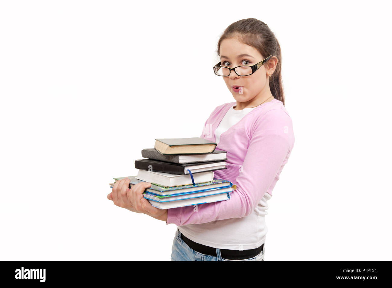 Girl schoolgirl with a stack of books on a white background Stock Photo ...