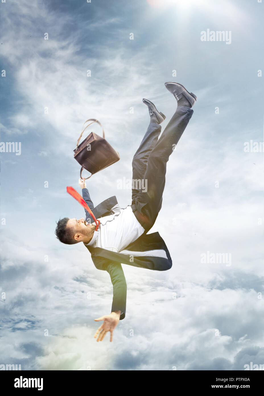 The frightened businessman in suit falling down and screaming against ...