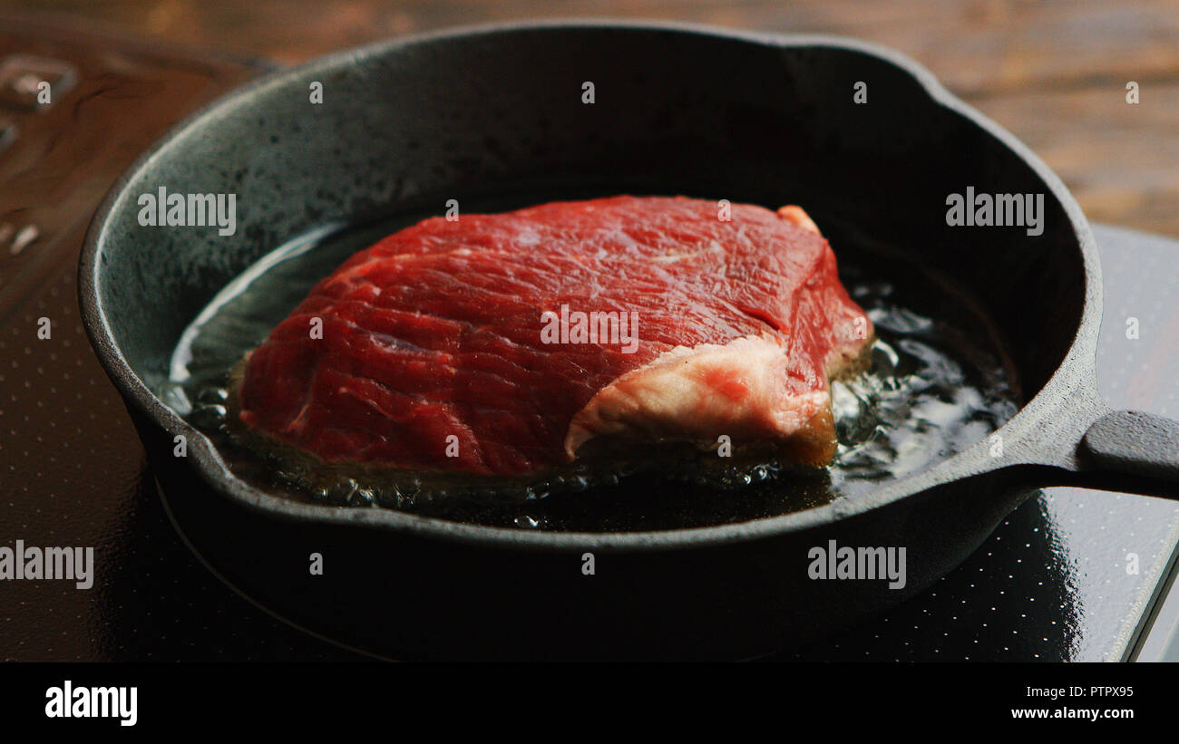 Meat frying on pan Stock Photo - Alamy