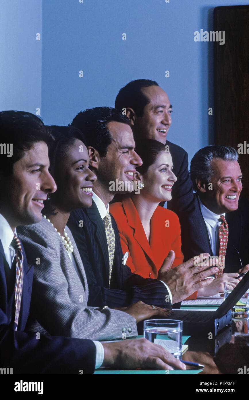 1995 HISTORICAL MULTI ETHNIC OFFICE WORKERS IN BOARDROOM MEETING Stock ...