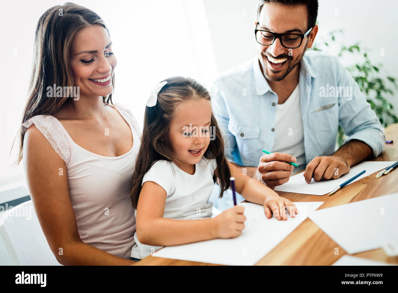 Happy family having fun time at home Stock Photo - Alamy