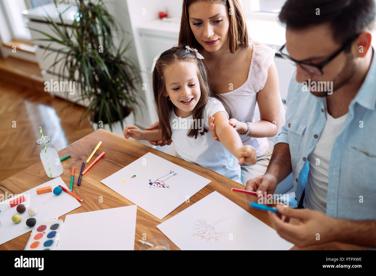 Happy family having fun time at home Stock Photo - Alamy
