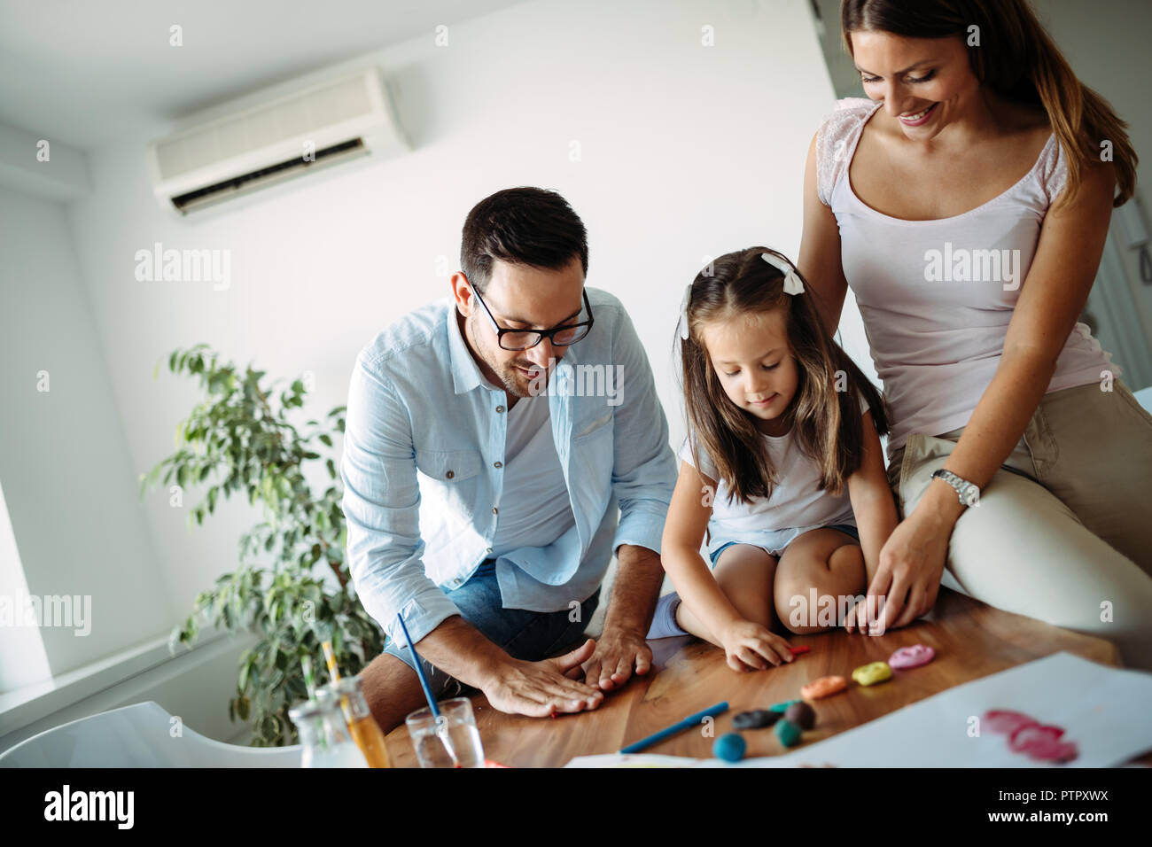Happy family having fun time at home Stock Photo - Alamy