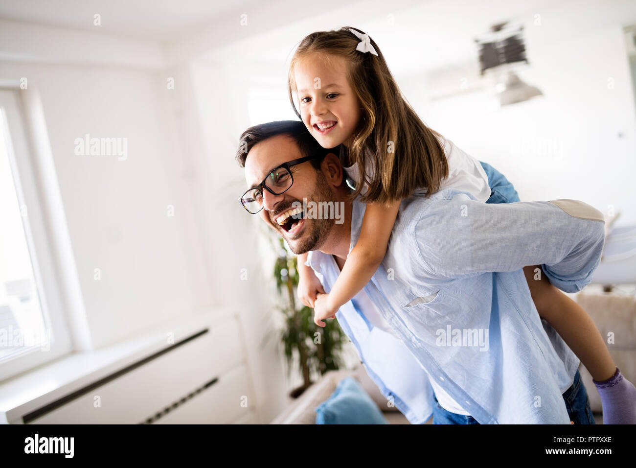 Happy family having fun time at home Stock Photo - Alamy