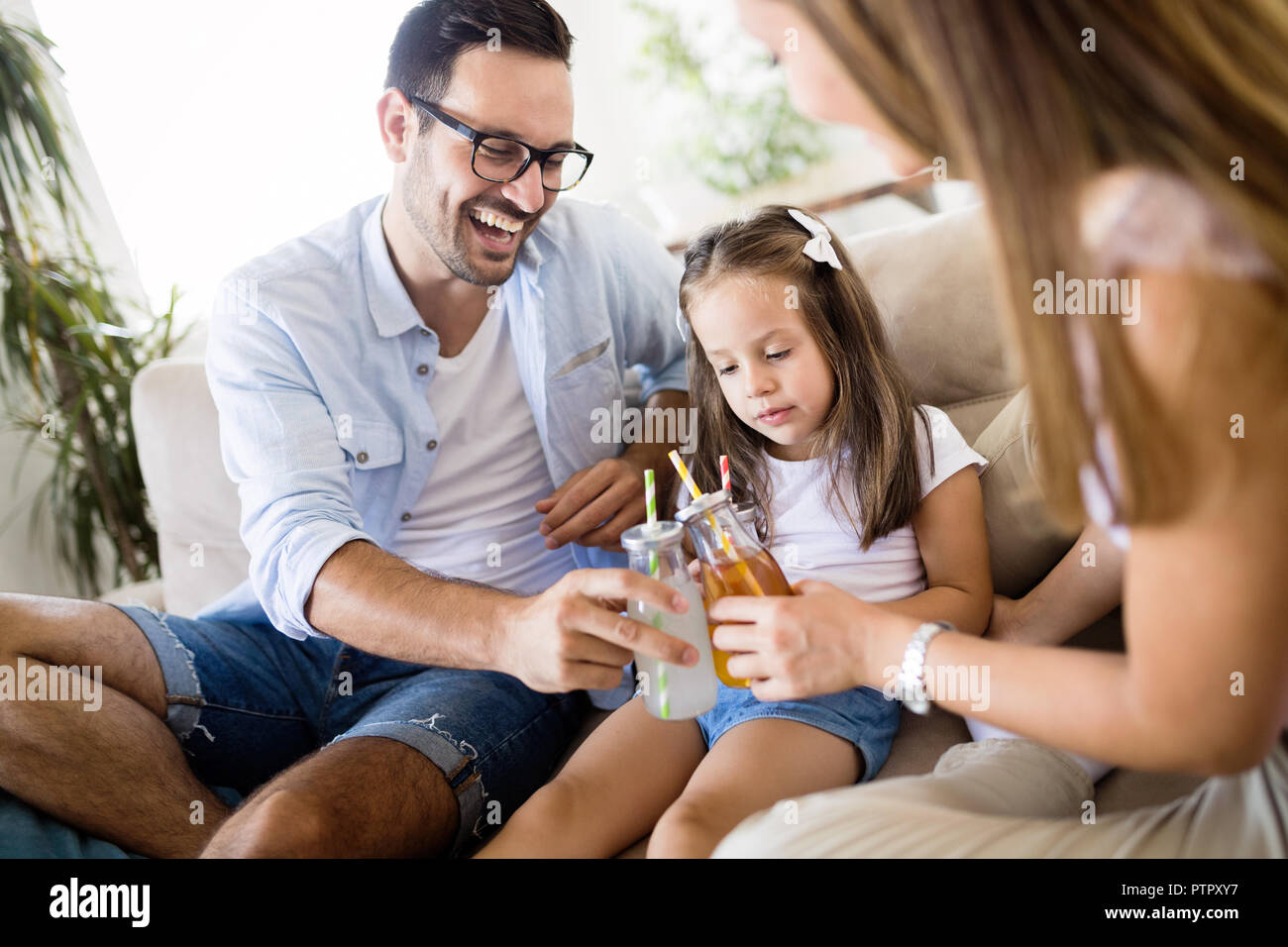 Happy family having fun time at home Stock Photo - Alamy