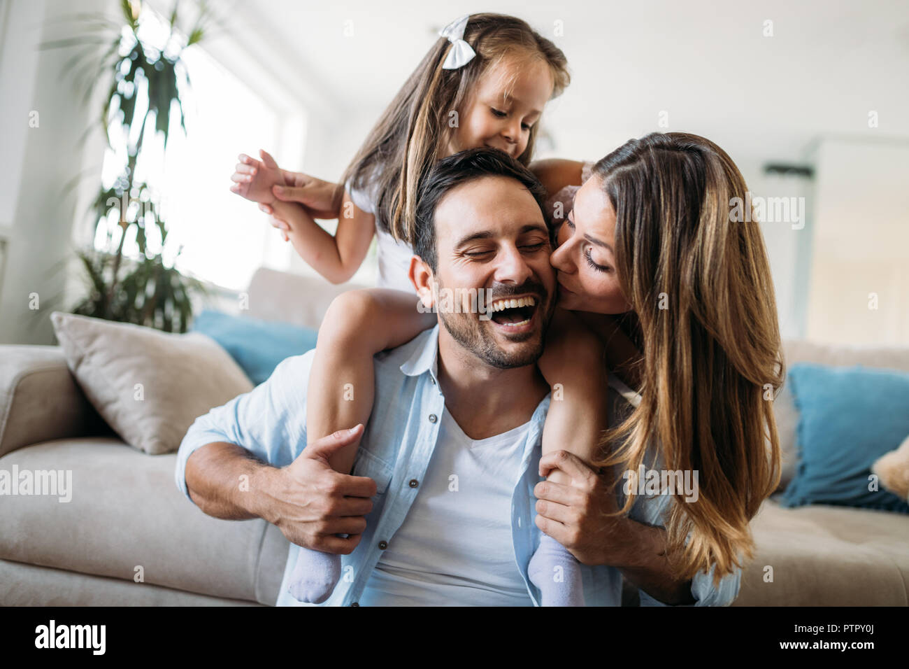 Happy family having fun time at home Stock Photo - Alamy
