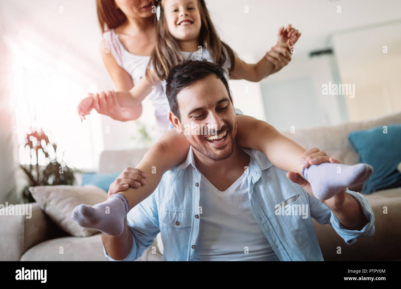 Happy family having fun time at home Stock Photo - Alamy
