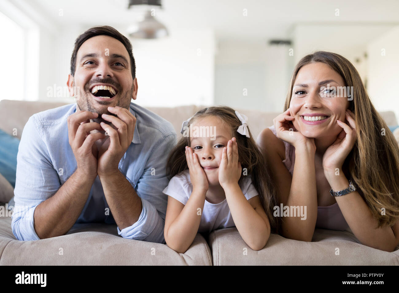 Happy family having fun time at home Stock Photo - Alamy