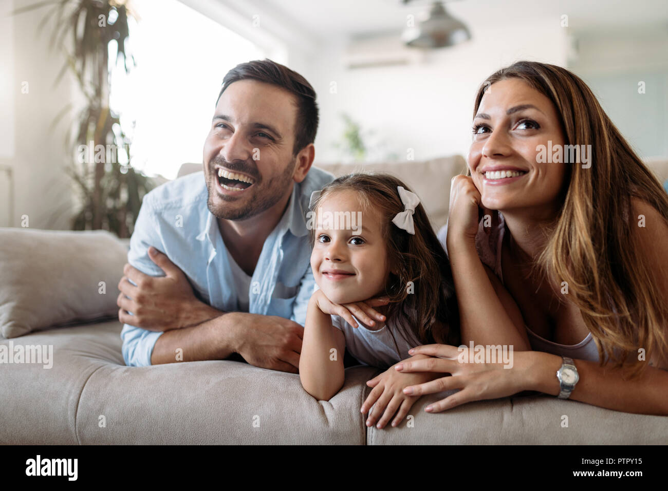 Happy family having fun time at home Stock Photo - Alamy