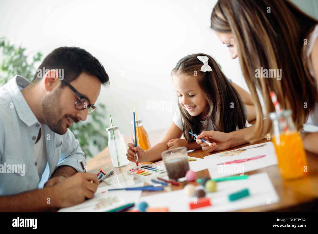 Happy family having fun time at home Stock Photo - Alamy