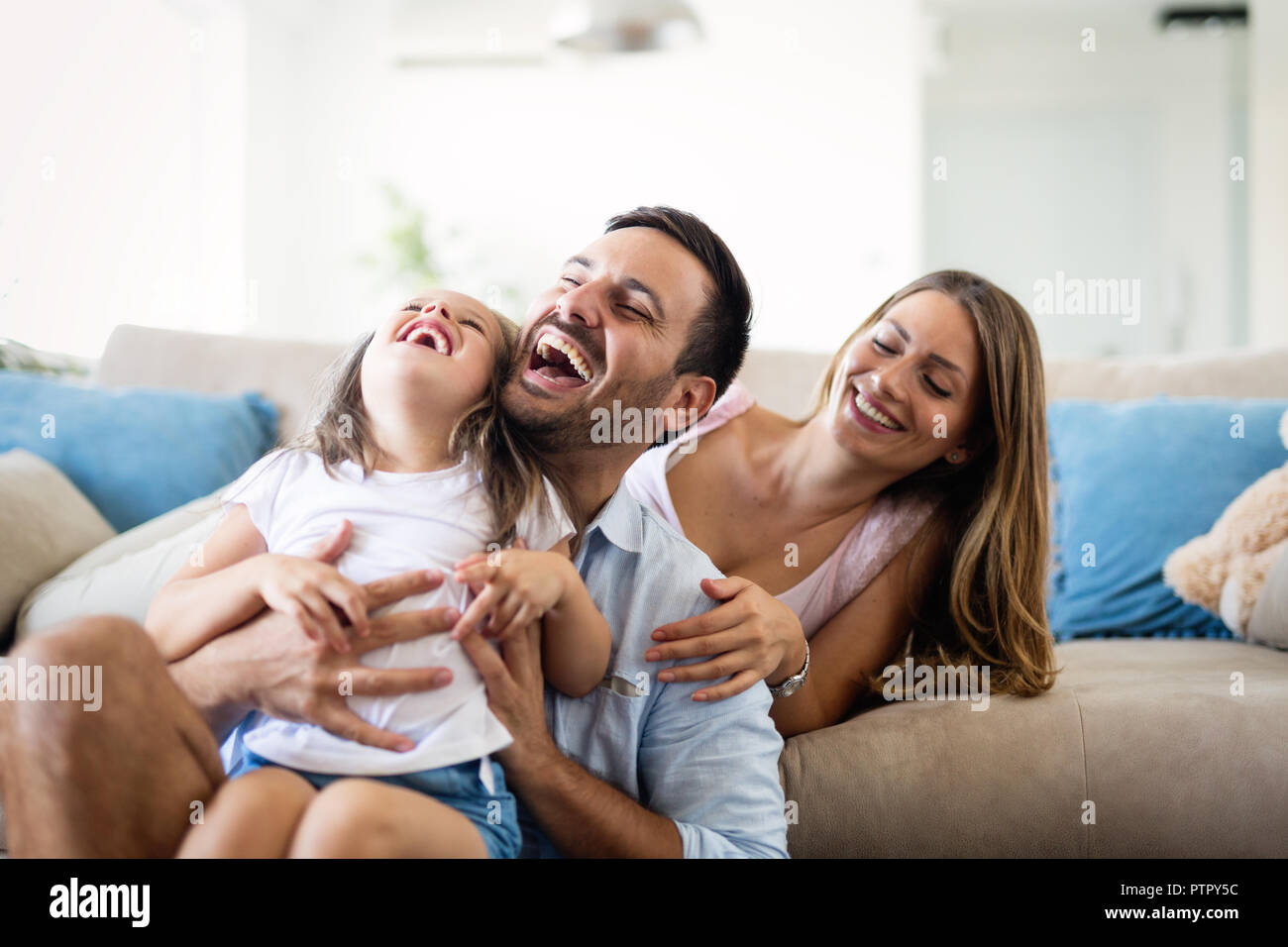 Happy family having fun time at home Stock Photo - Alamy