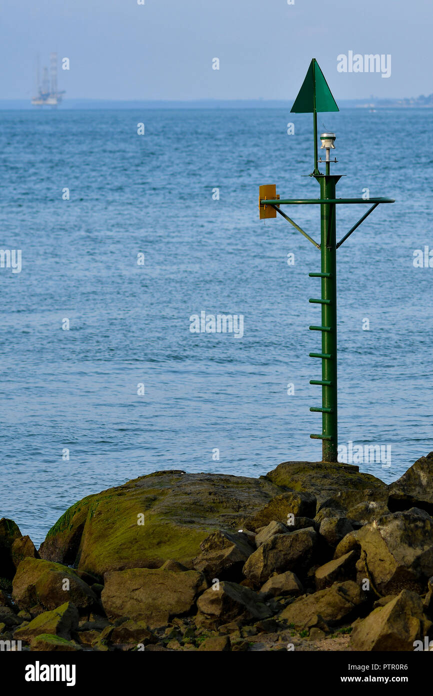 Green warning sea mark Stock Photo - Alamy