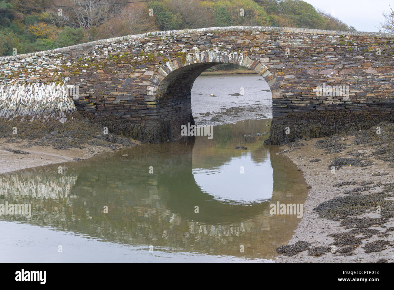 single arch stone bridge over a tidal creek in west cork ireland Stock ...