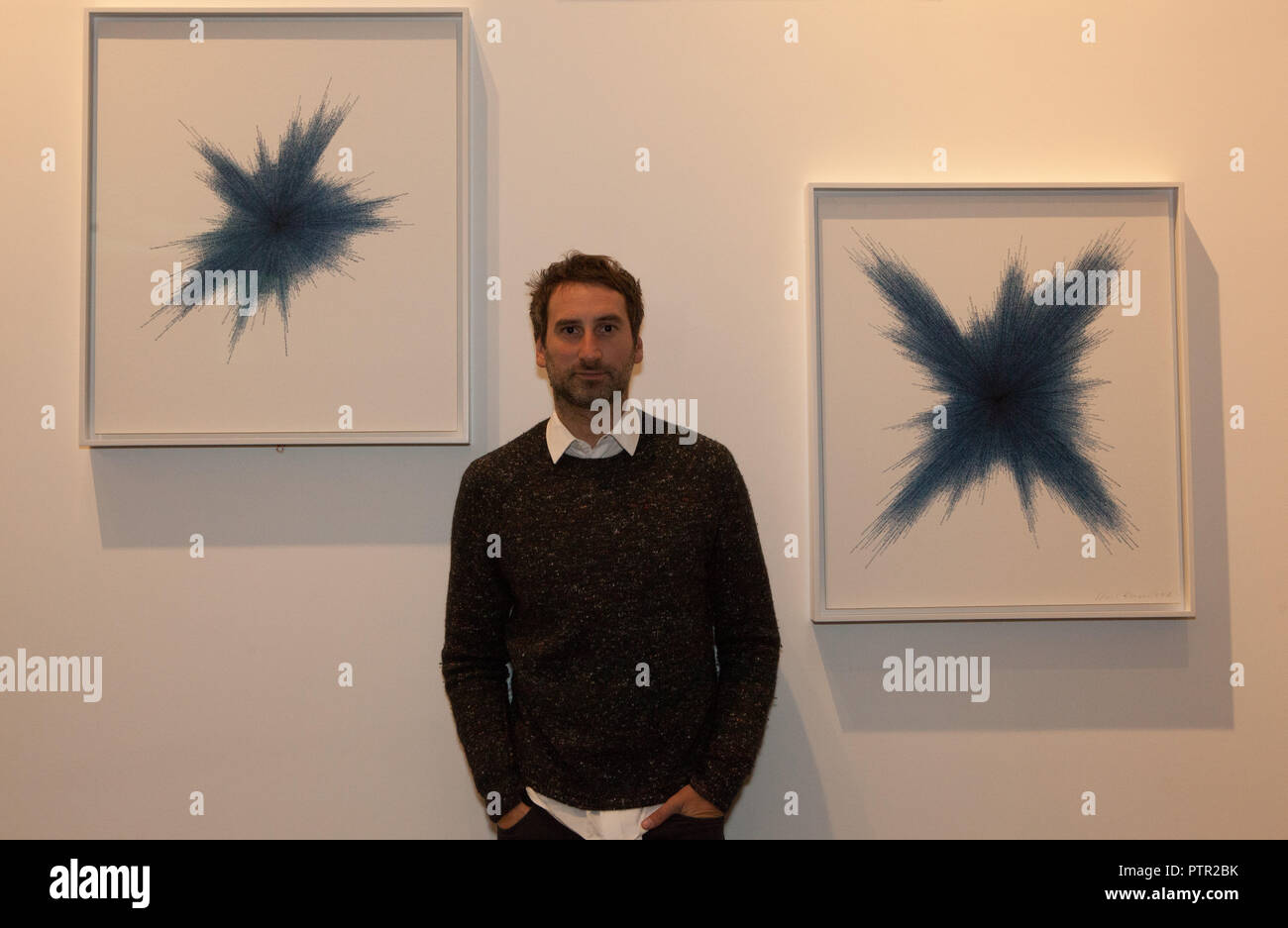 British artist Idris Khan oversees the installation of his work '21 ...