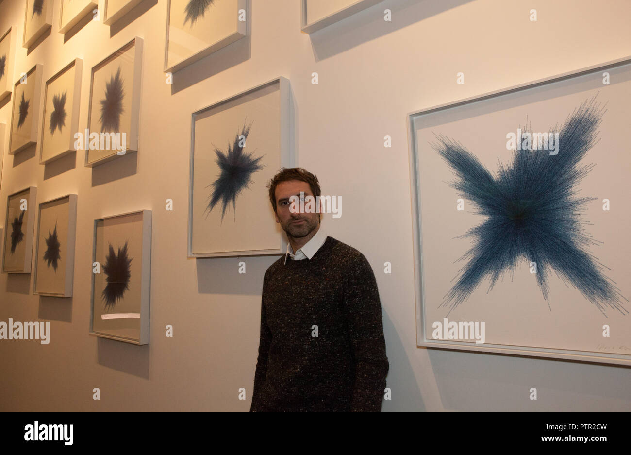 British artist Idris Khan oversees the installation of his work '21 ...
