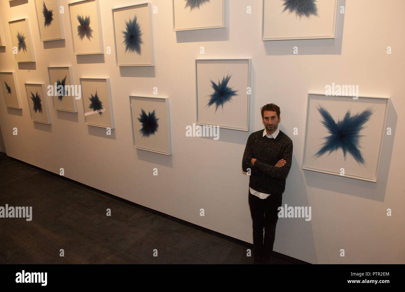 British artist Idris Khan oversees the installation of his work '21 ...