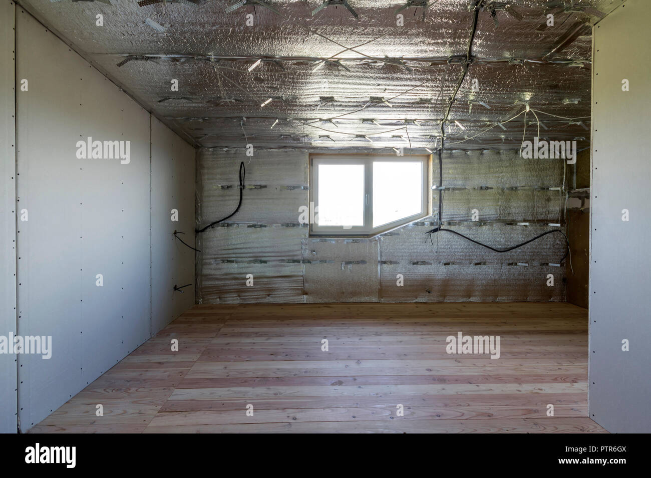 Big empty room under construction and renovation with silver aluminum ...