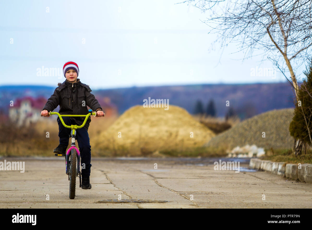 Little boy riding his bicycle in park outdoors Stock Photo - Alamy