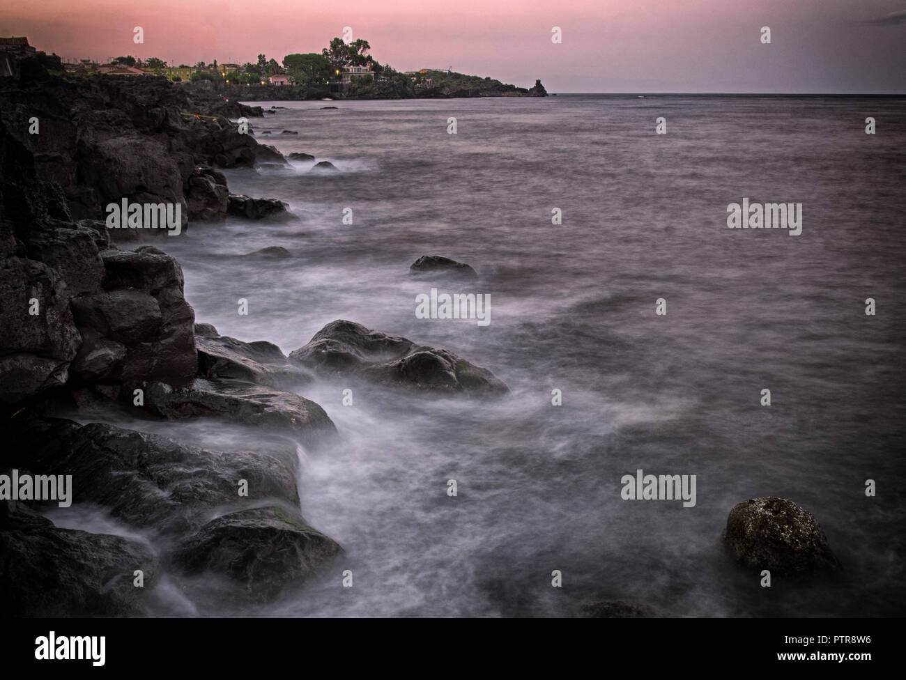 sunet in acitrezza, catania ( Sicily). A wonderful vulcan beach Stock ...