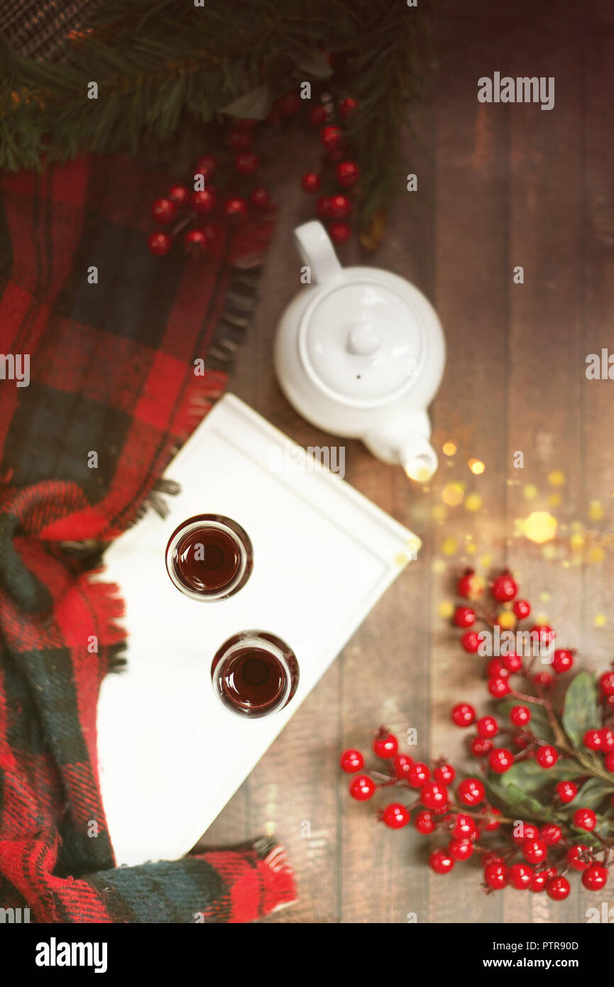 Christmas mulled wine cozy top view with blanket, two glasses and tea ...