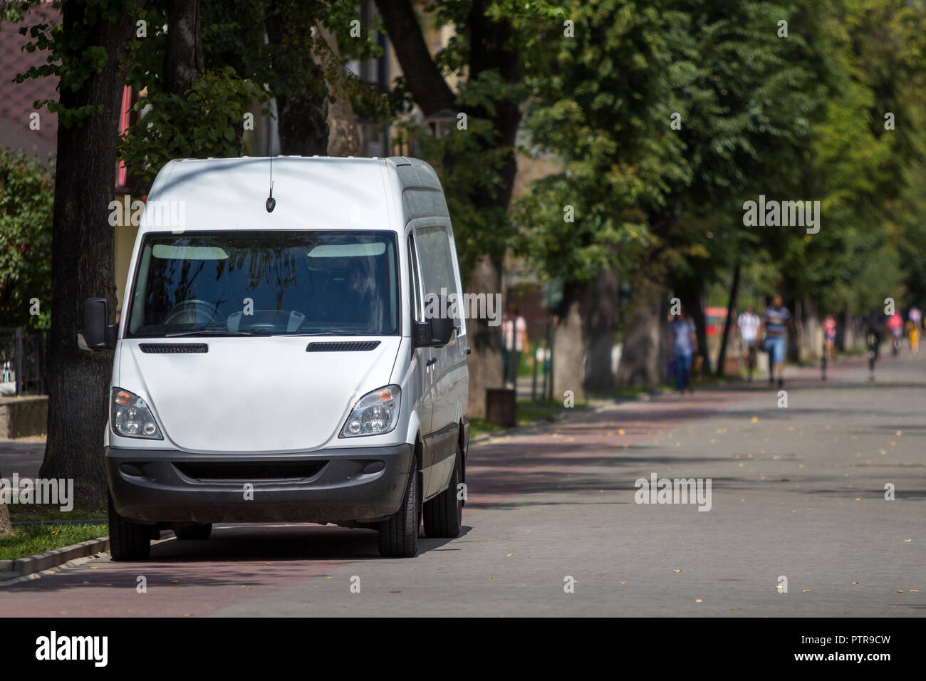 White passenger medium size commercial German luxury minibus van parked ...