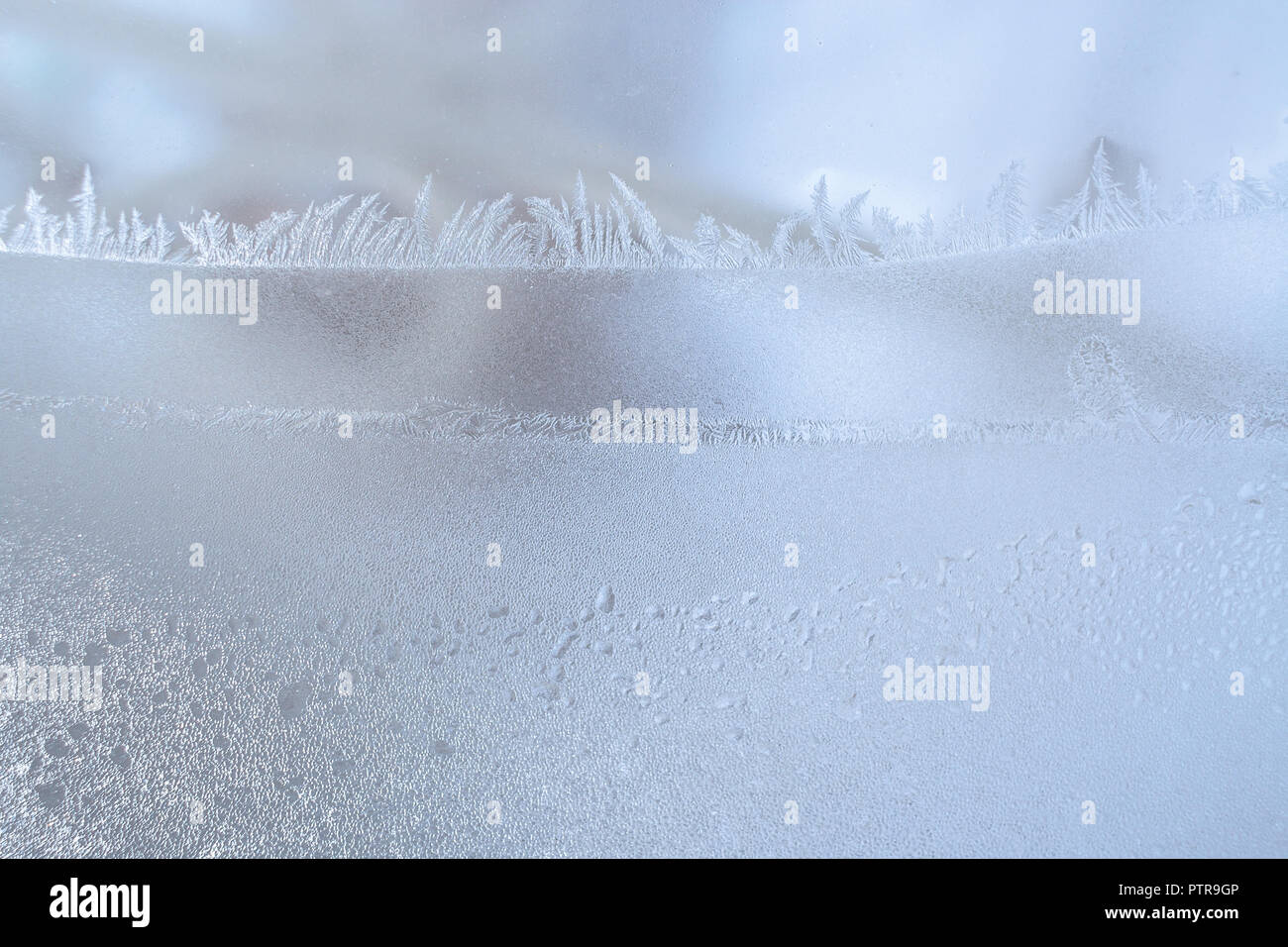Frozen window pane with stripe of frosty pattern similar as trees Stock ...