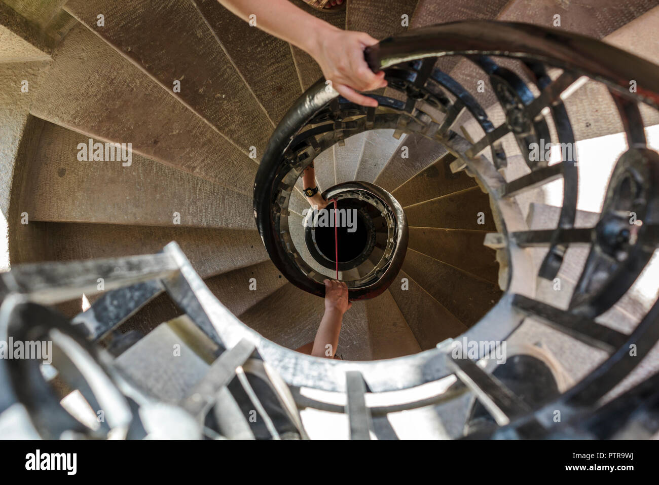 People going down spiral stairs Stock Photo - Alamy