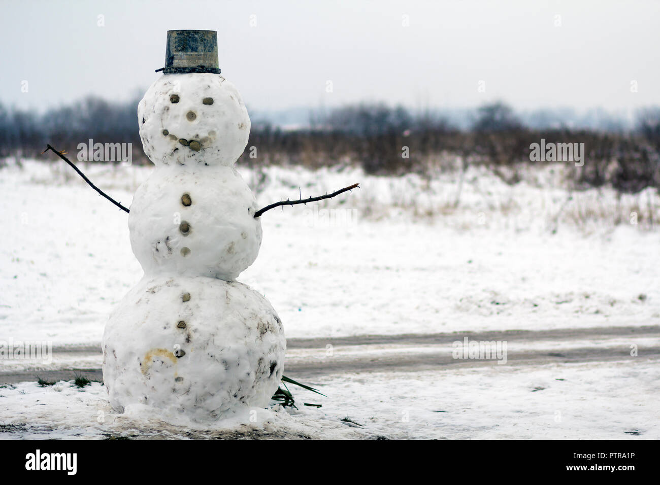 Big funny traditional primitive smiling snowman with bucket hat on ...