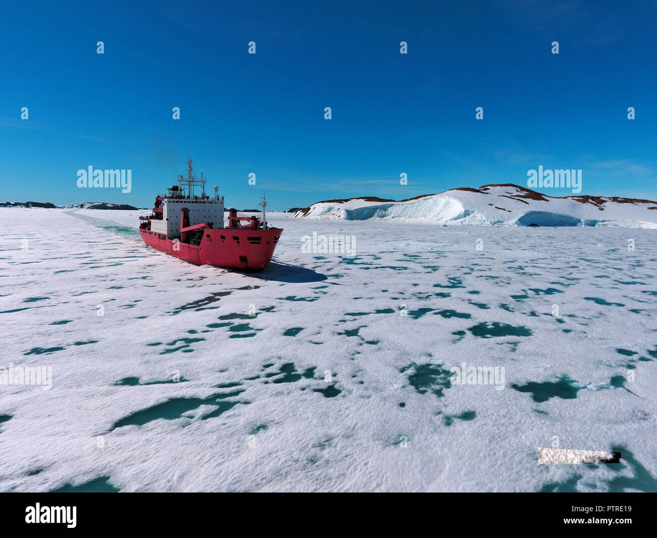 Cargo ship arrives in port for unloading on an ice floe. Antarctic ...