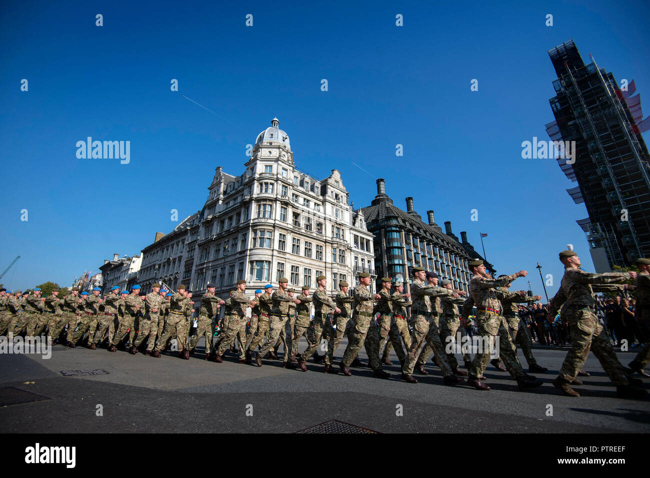 Army personnel marching in London led by the Band of the Grenadier ...