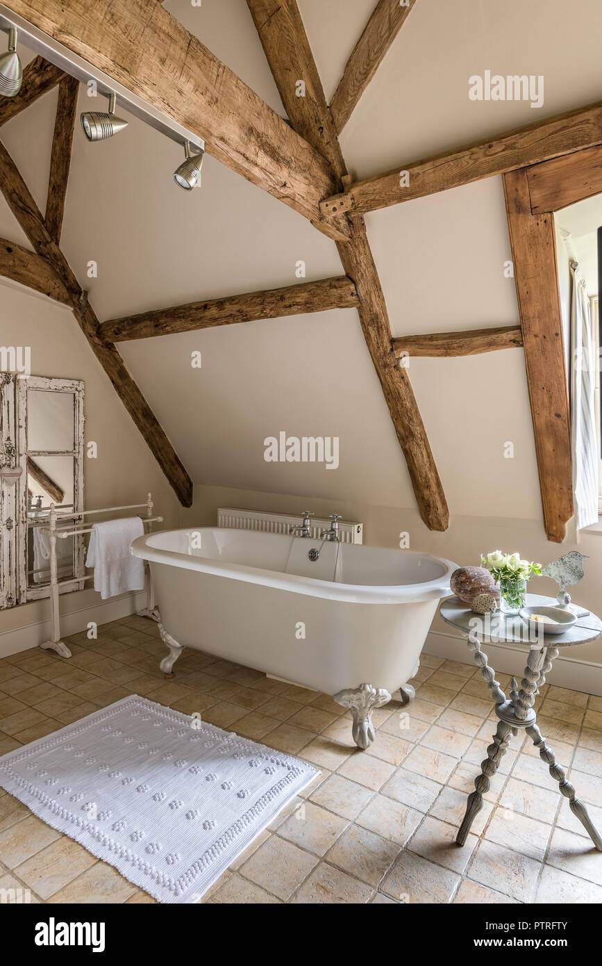 16th century farmhouse renovation Freestanding bath below timber framed ...