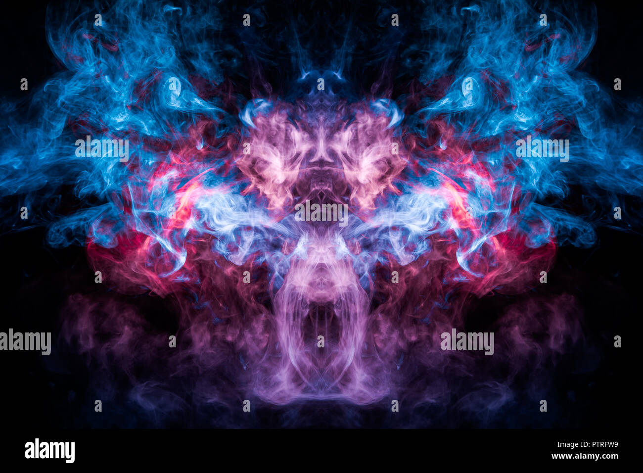 Dense multicolored smoke of blue and purple colors in the form of a ...