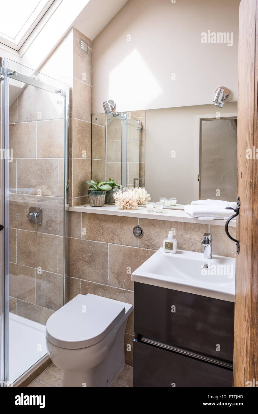Small bathroom withglass shower screen Stock Photo - Alamy