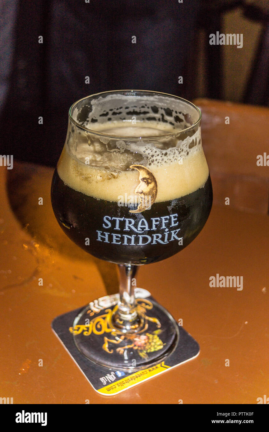 A glass of Straffe Hendrik Quadrupel dark beer, "Le Trappiste" cellar ...