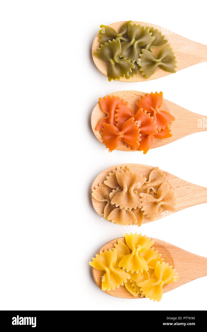 Farfalle pasta. Colorful italian pasta in wooden scoop isolated on ...