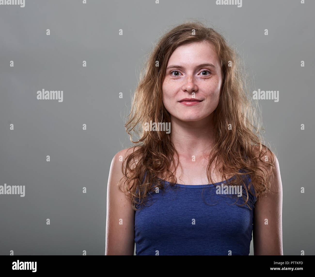 Closeup portrait of a beautiful woman with no makeup, studio shot on ...