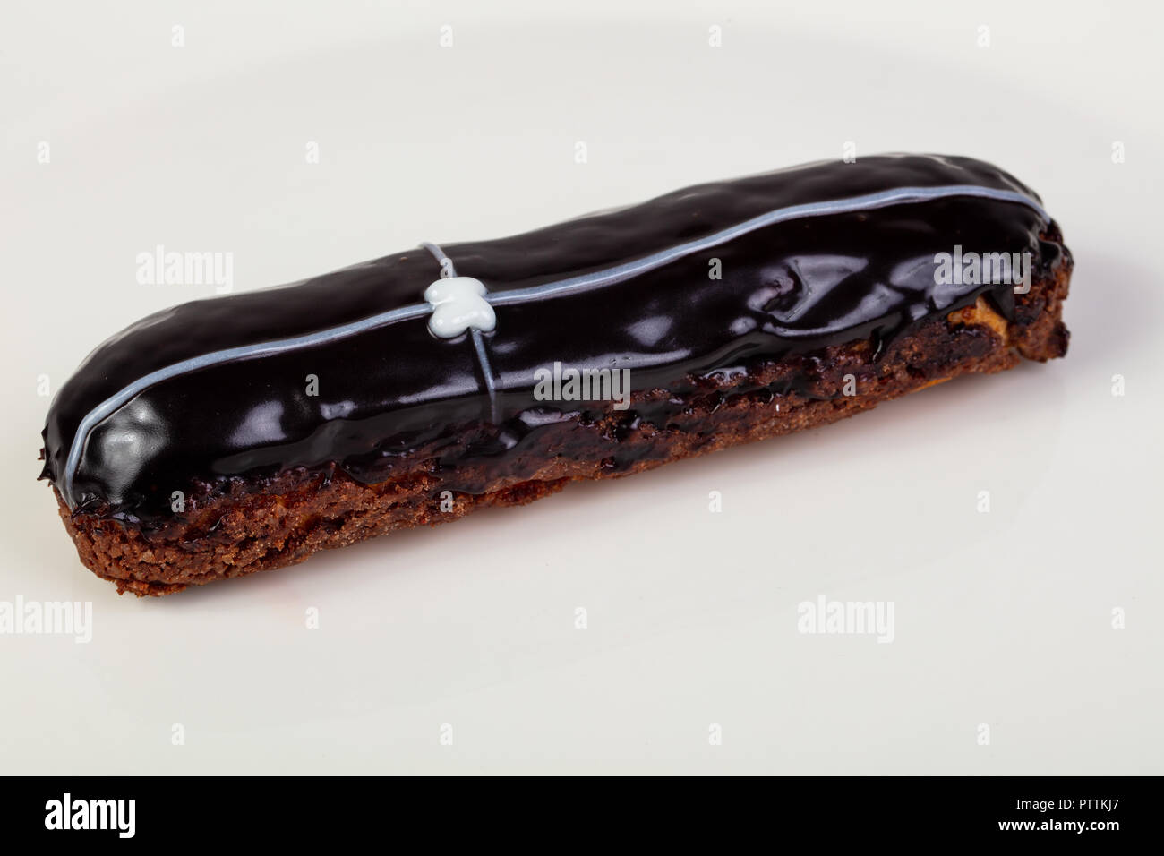 Tasty sweet Eclair with cream Stock Photo - Alamy