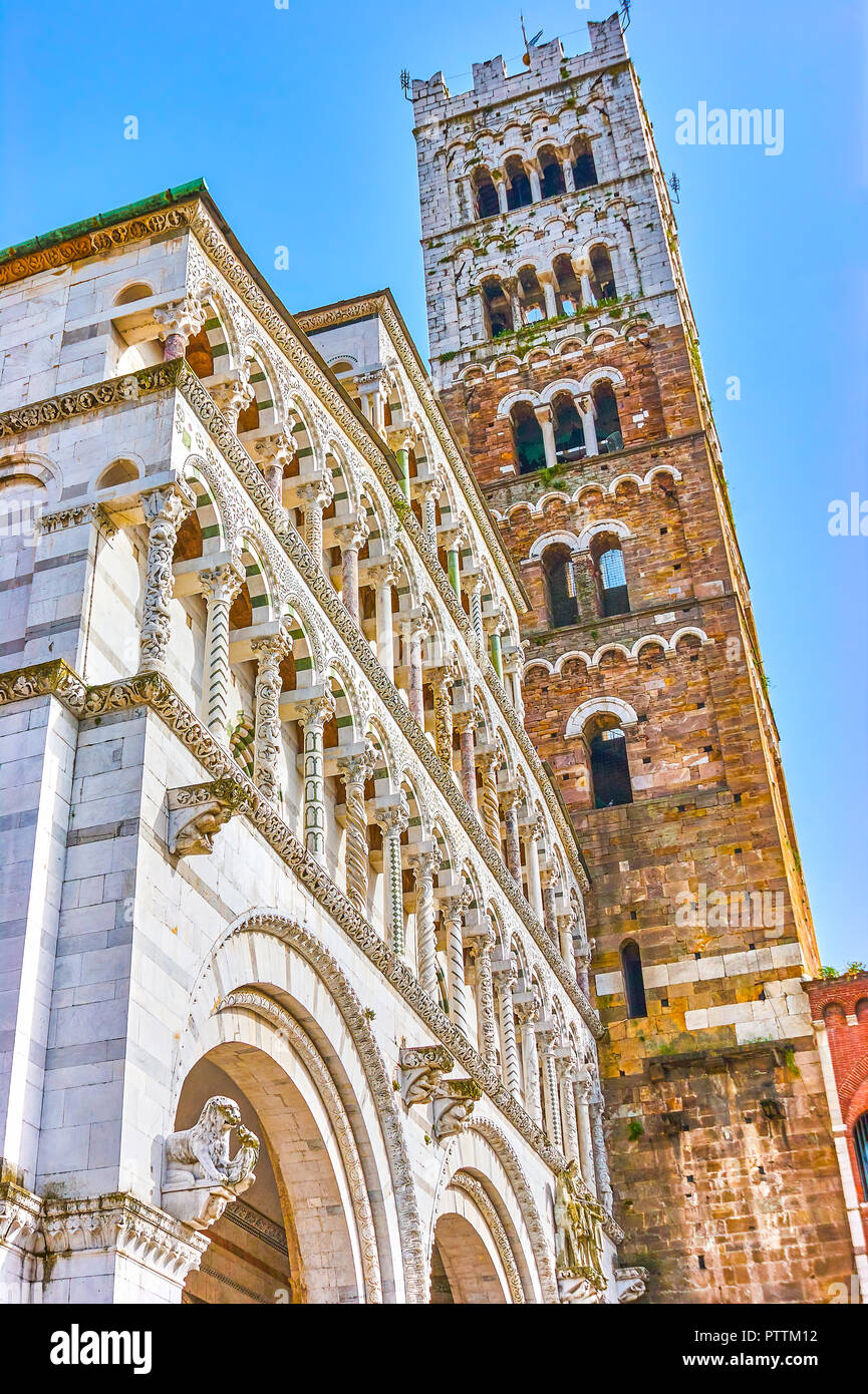 The beautiful frontage of Lucca Duomo with marble columnar arcades and ...
