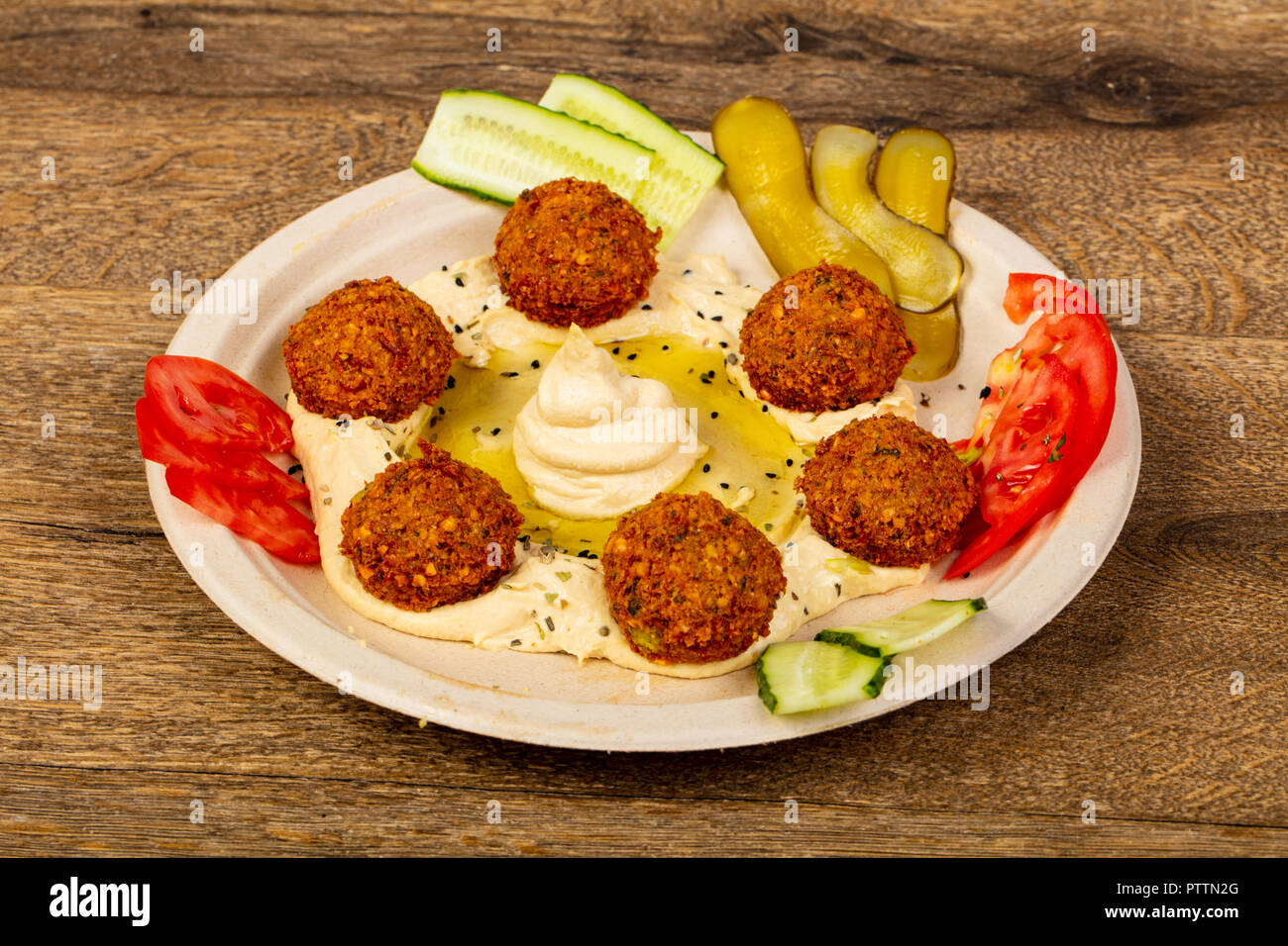 Humus with falafel and olive oil Stock Photo - Alamy