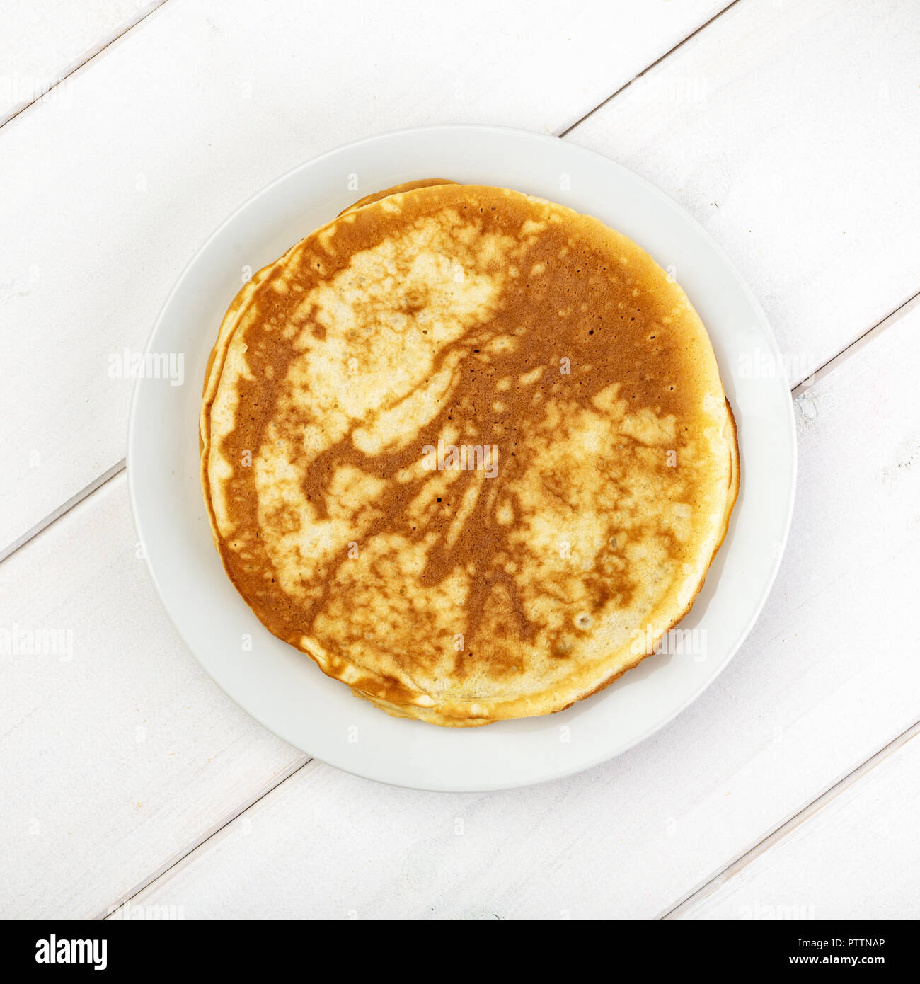 Round thin pancake on the plate Stock Photo - Alamy