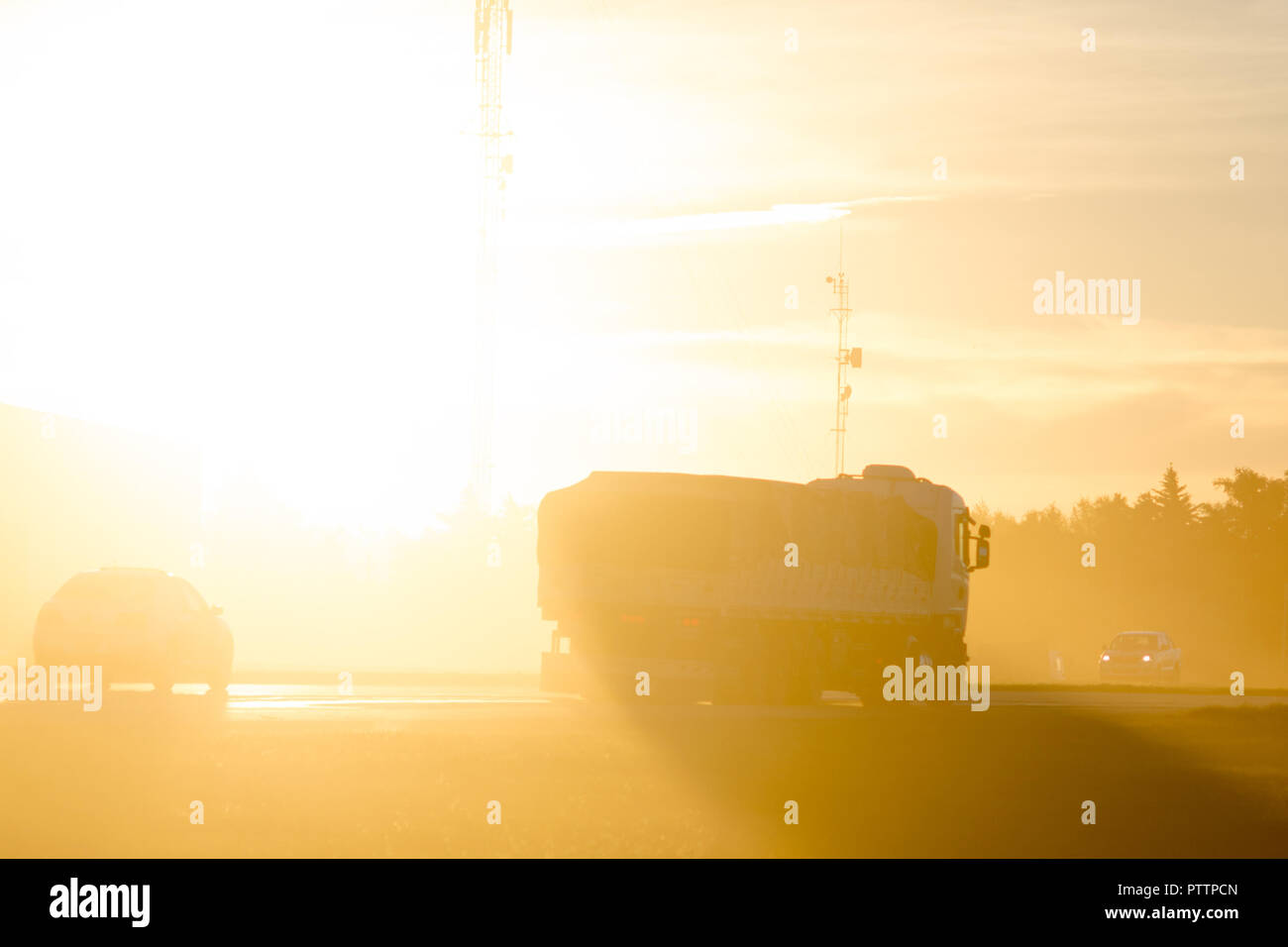 Semi-Truck On Highway at Sunset Stock Photo - Alamy