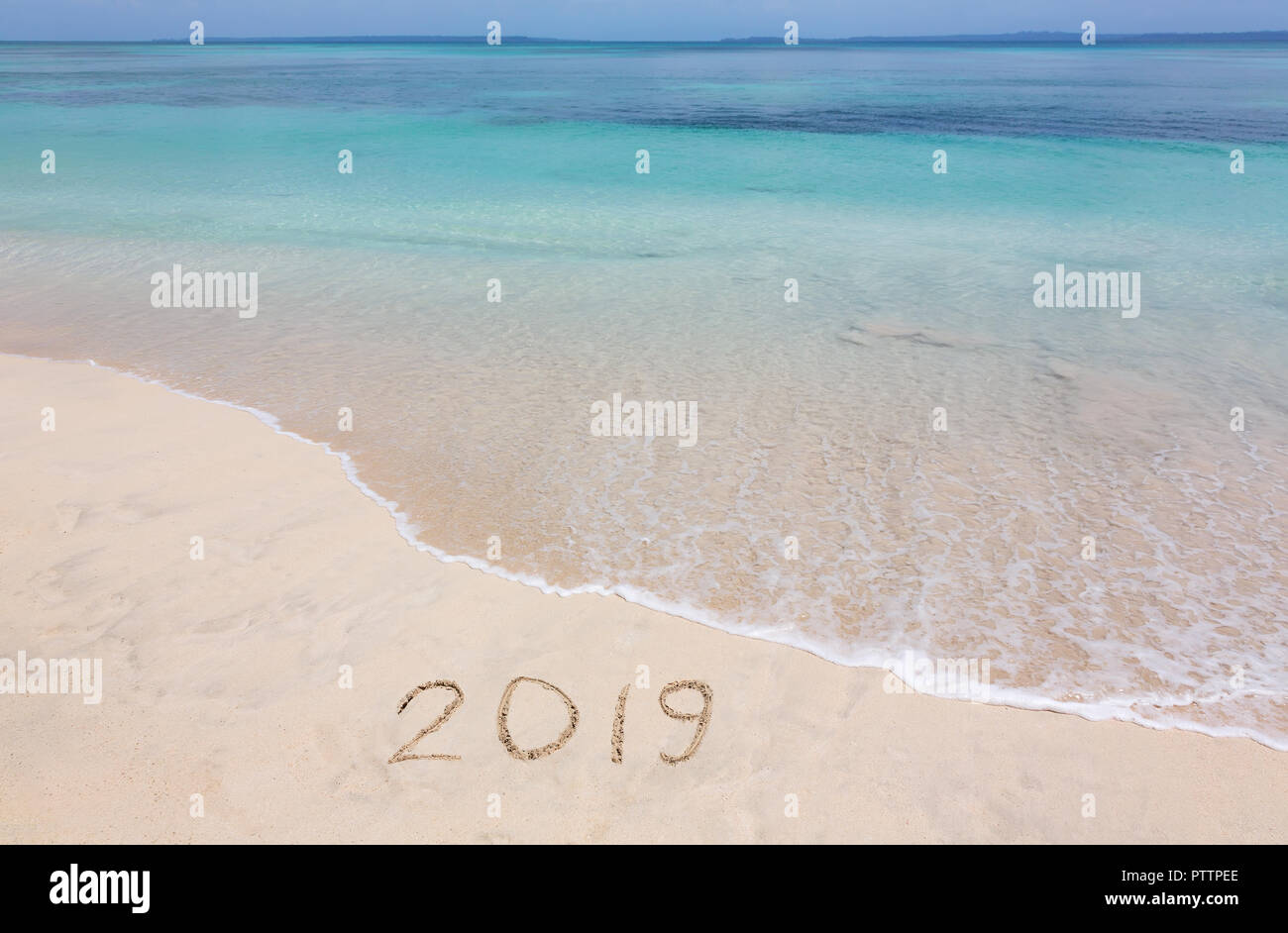 Happy New Year 2019 creative on the beach Stock Photo - Alamy