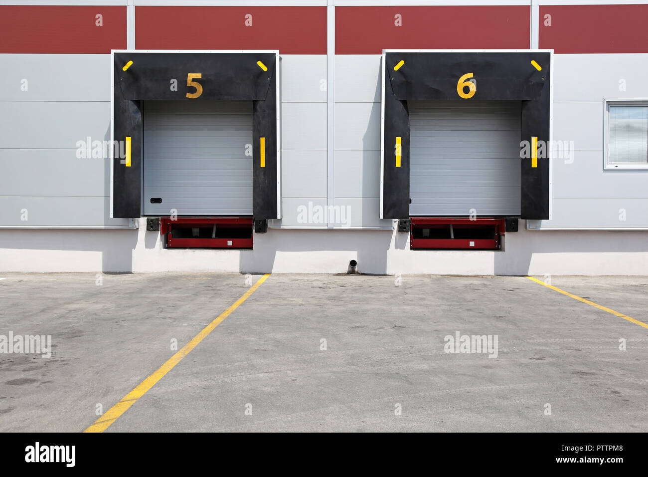 Two dock doors at warehouse for loading lorry Stock Photo - Alamy