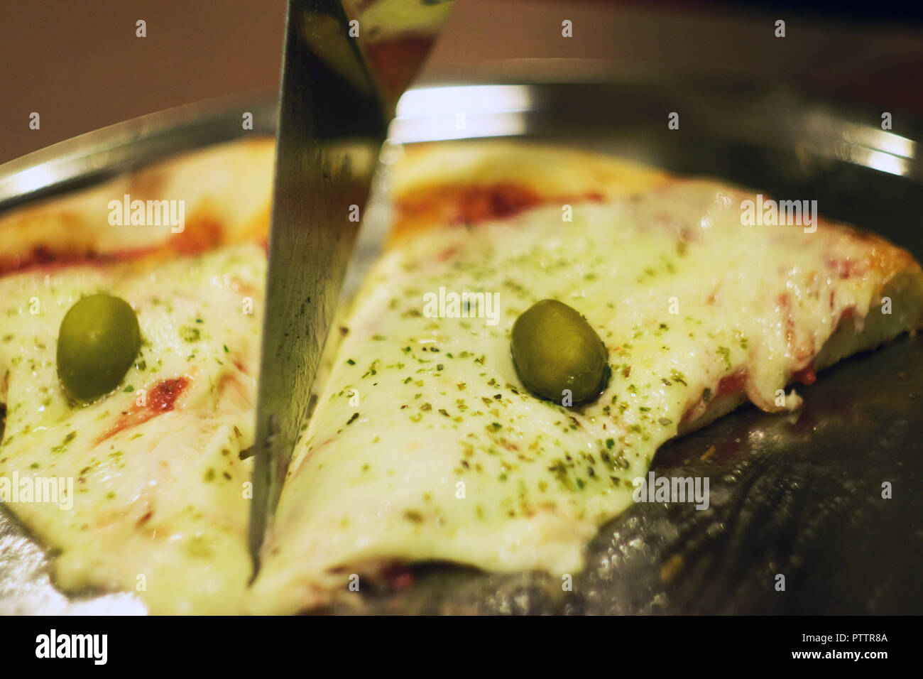 Cutting slice of mozzarella pizza Stock Photo - Alamy