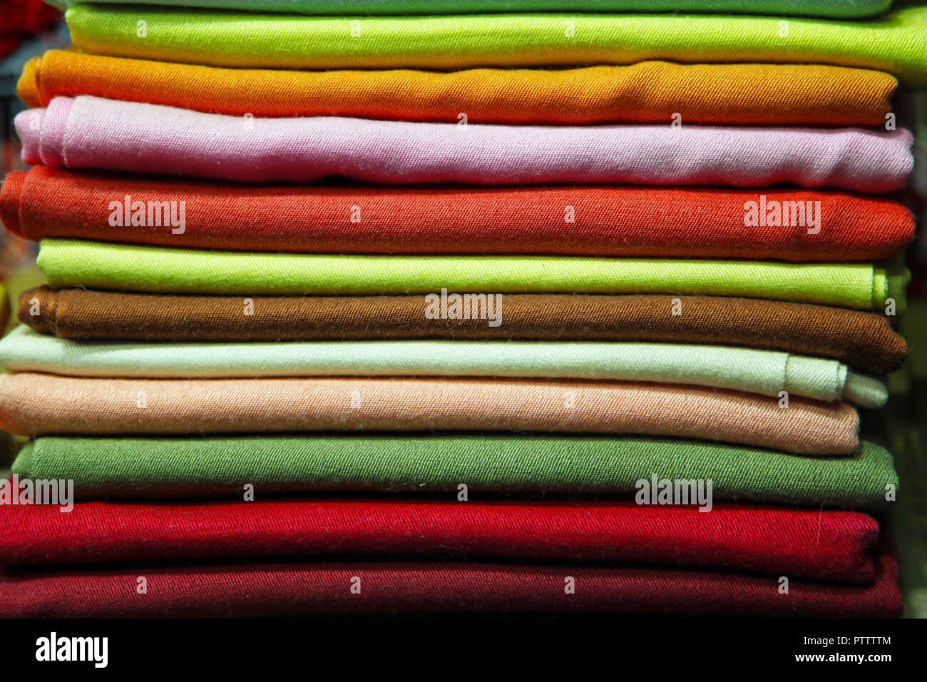 Big pile of colouful cloth textile Stock Photo - Alamy