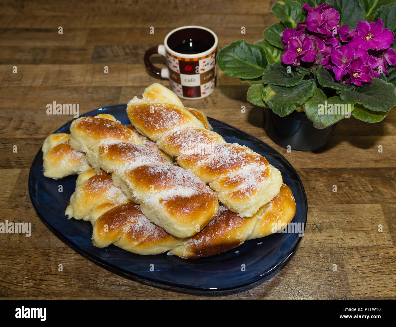 Homemade sweet bread, braided by hand, covered with sugar and grated ...