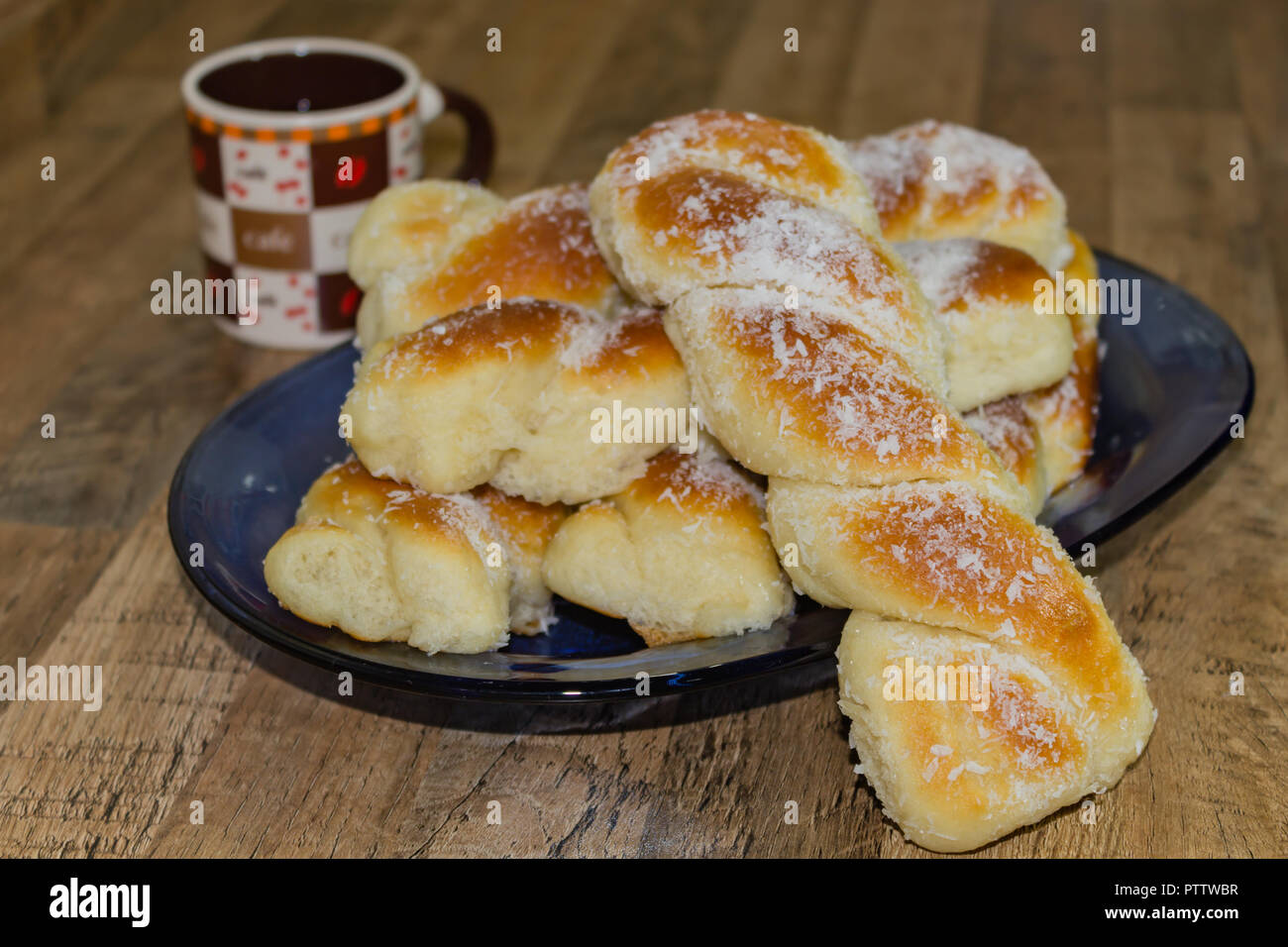 Homemade sweet bread, braided by hand, covered with sugar and grated ...