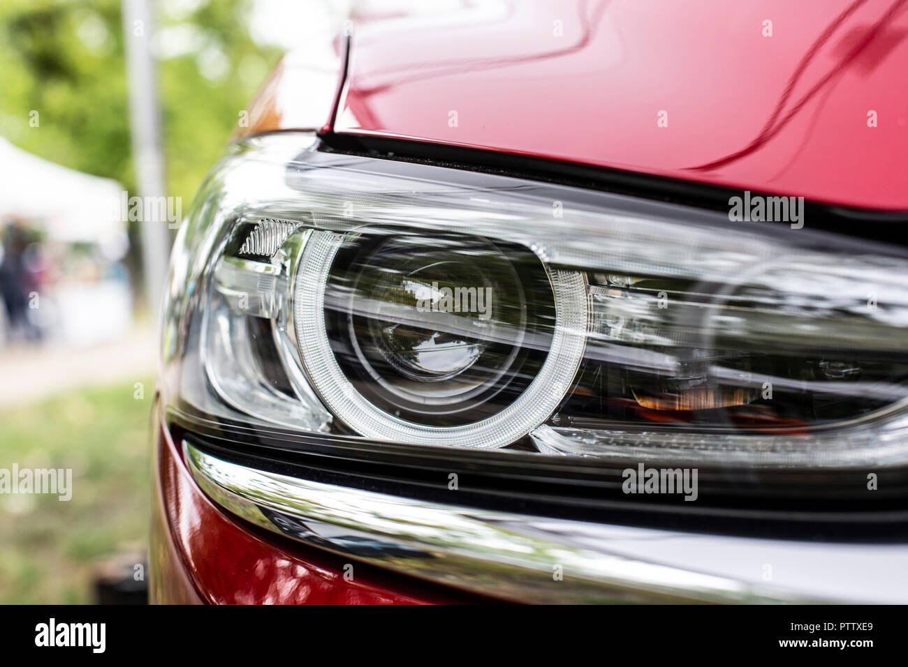 Red compact SUV car with sport and modern design parked on concrete ...