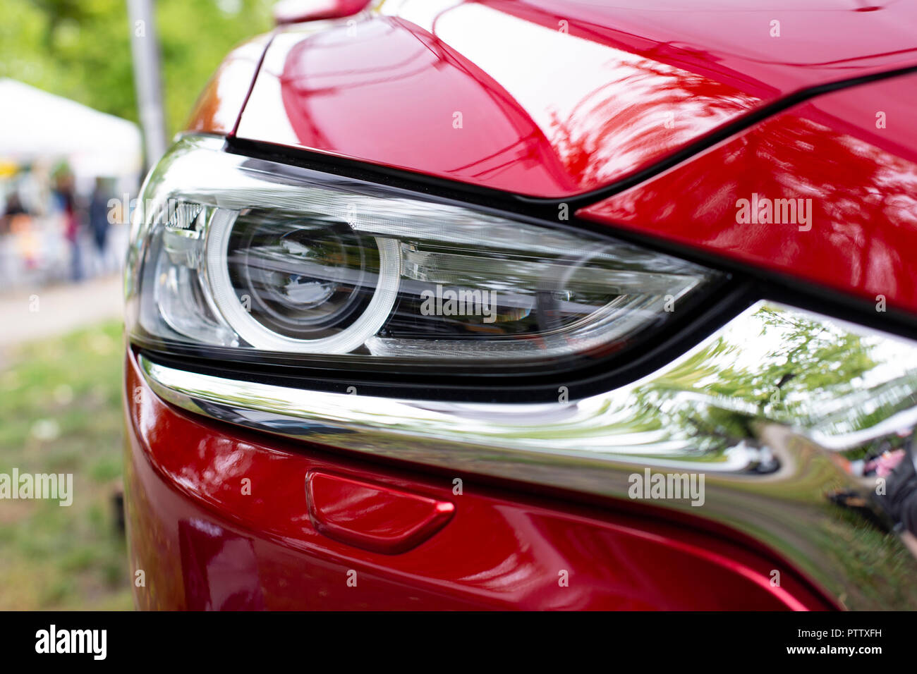 Red compact SUV car with sport and modern design parked on concrete ...